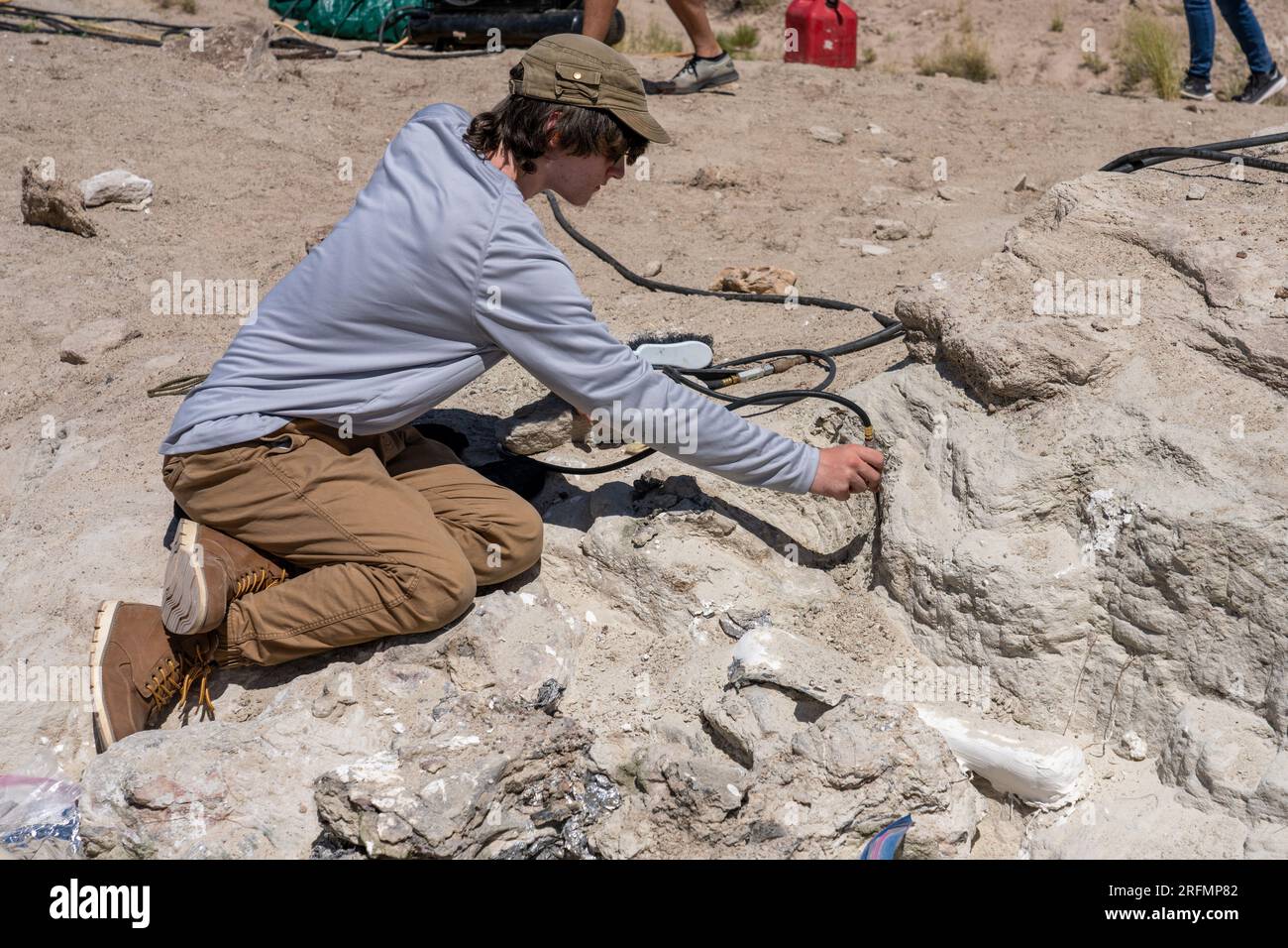 Dinosaur bone fossil being excavated in the Burpee Dinosaur Quarry in ...