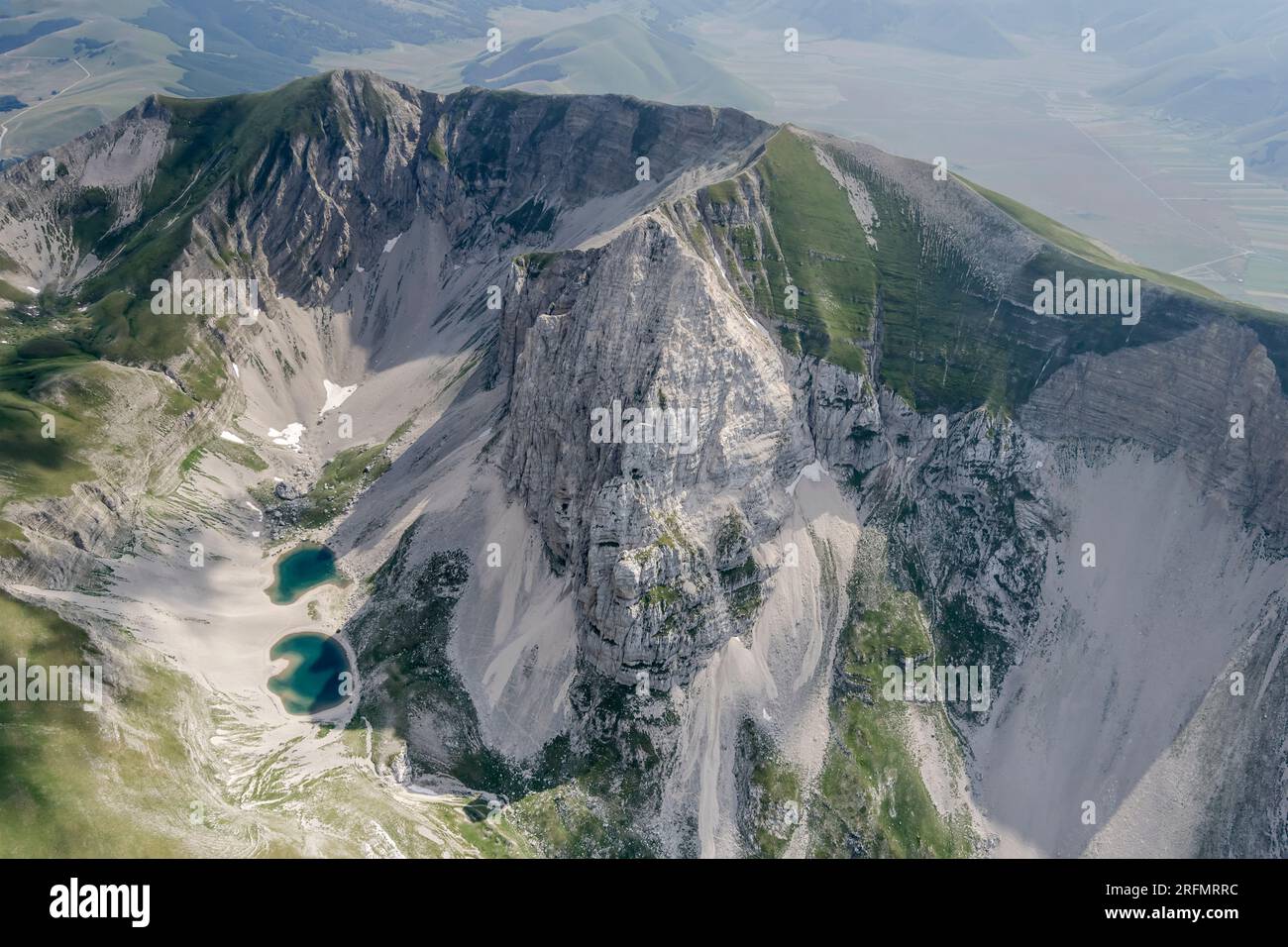 aerial landscape, from a glider plane, with Pilato mountain lake among ...