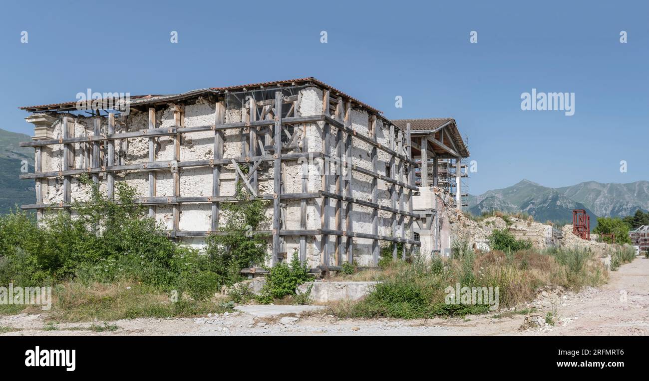 cityscape with wooden structural scaffolding on remains of old ...