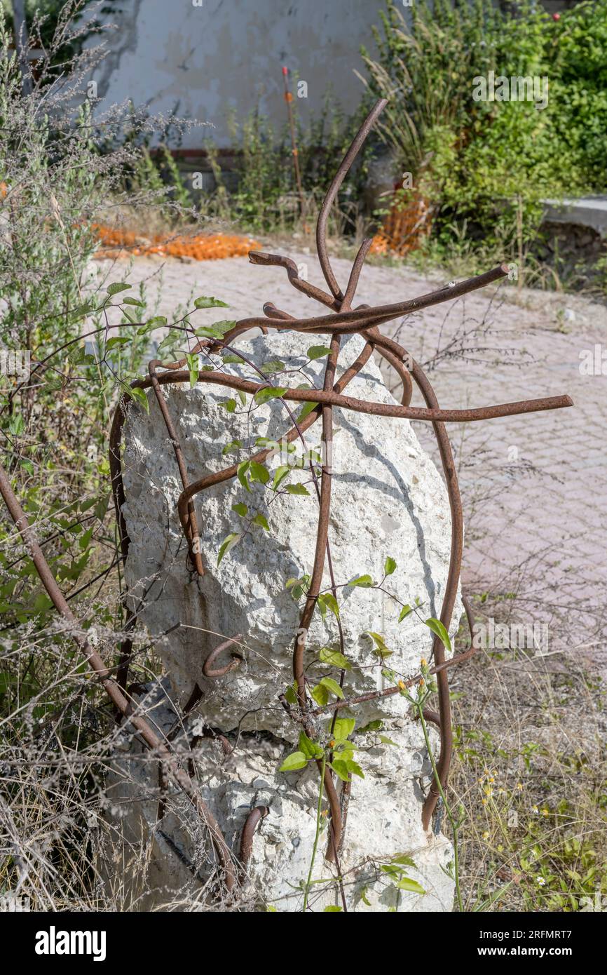cityscape with warped reinforcing steel on remains of buildings in ...