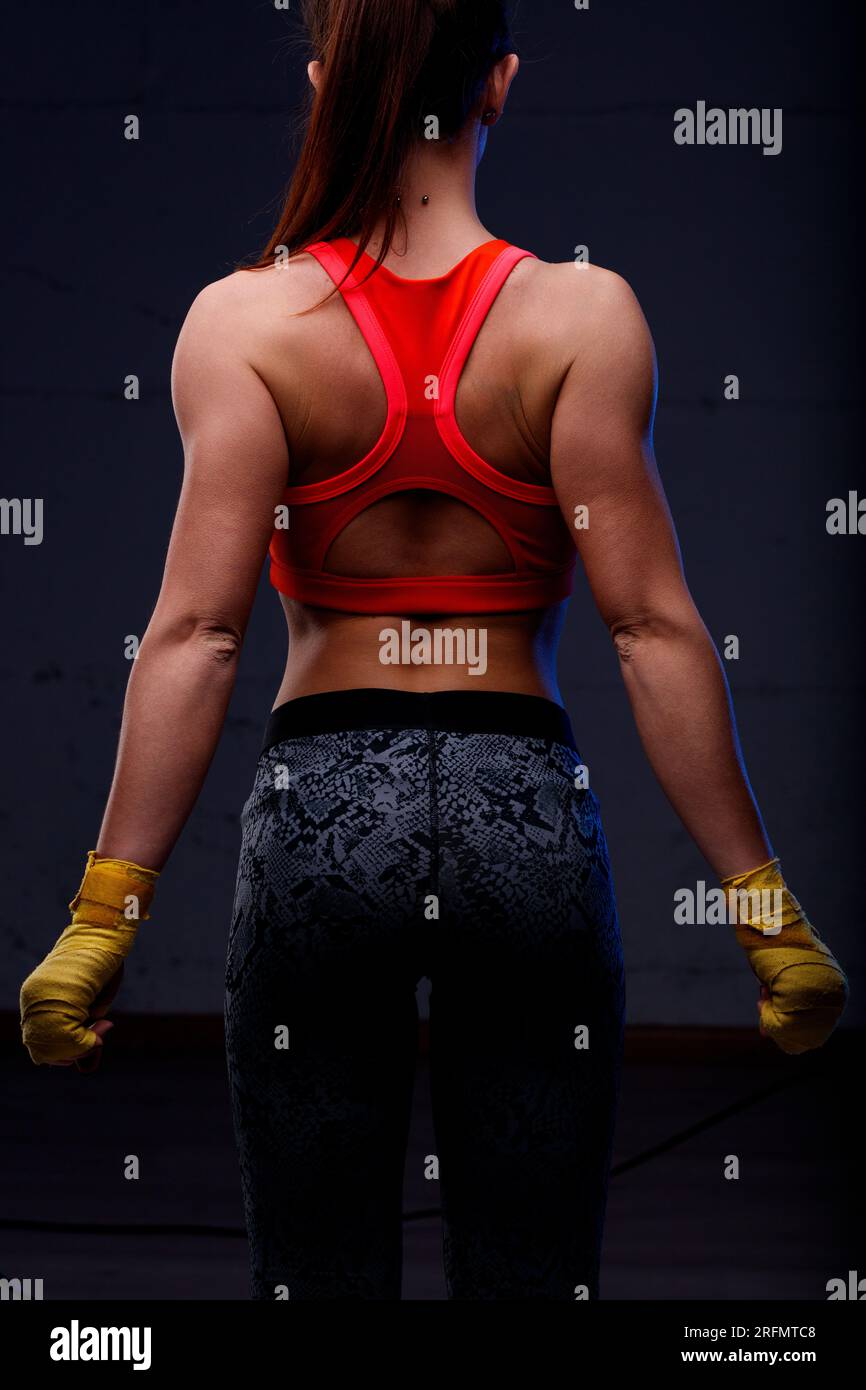 Kick-boxer, toned, muscular back leading to firm behind, undeterred by ...