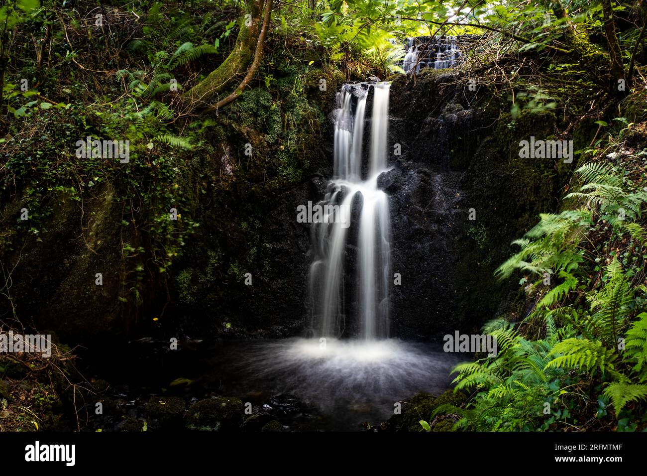 Beautiful hidden waterfall in Connemara National park Ireland in summer ...