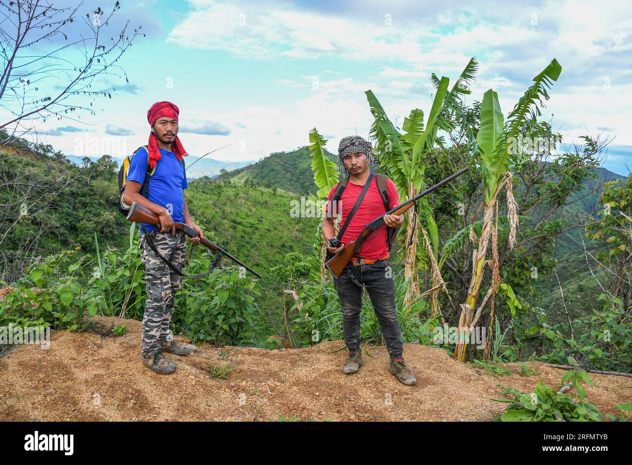 Armed volunteers from the Kuki-Zo tribe poses for a photo during their ...