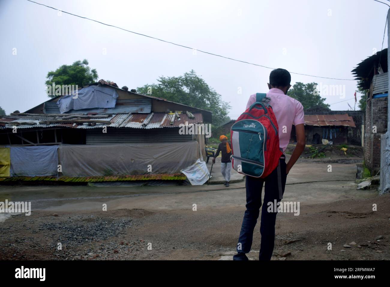 teen student boy wearing school uniform and face mask going to school ...