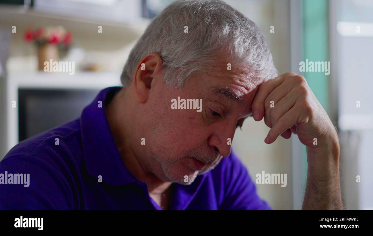 Hopeless senior man struggling with depression alone at home. Close-up ...