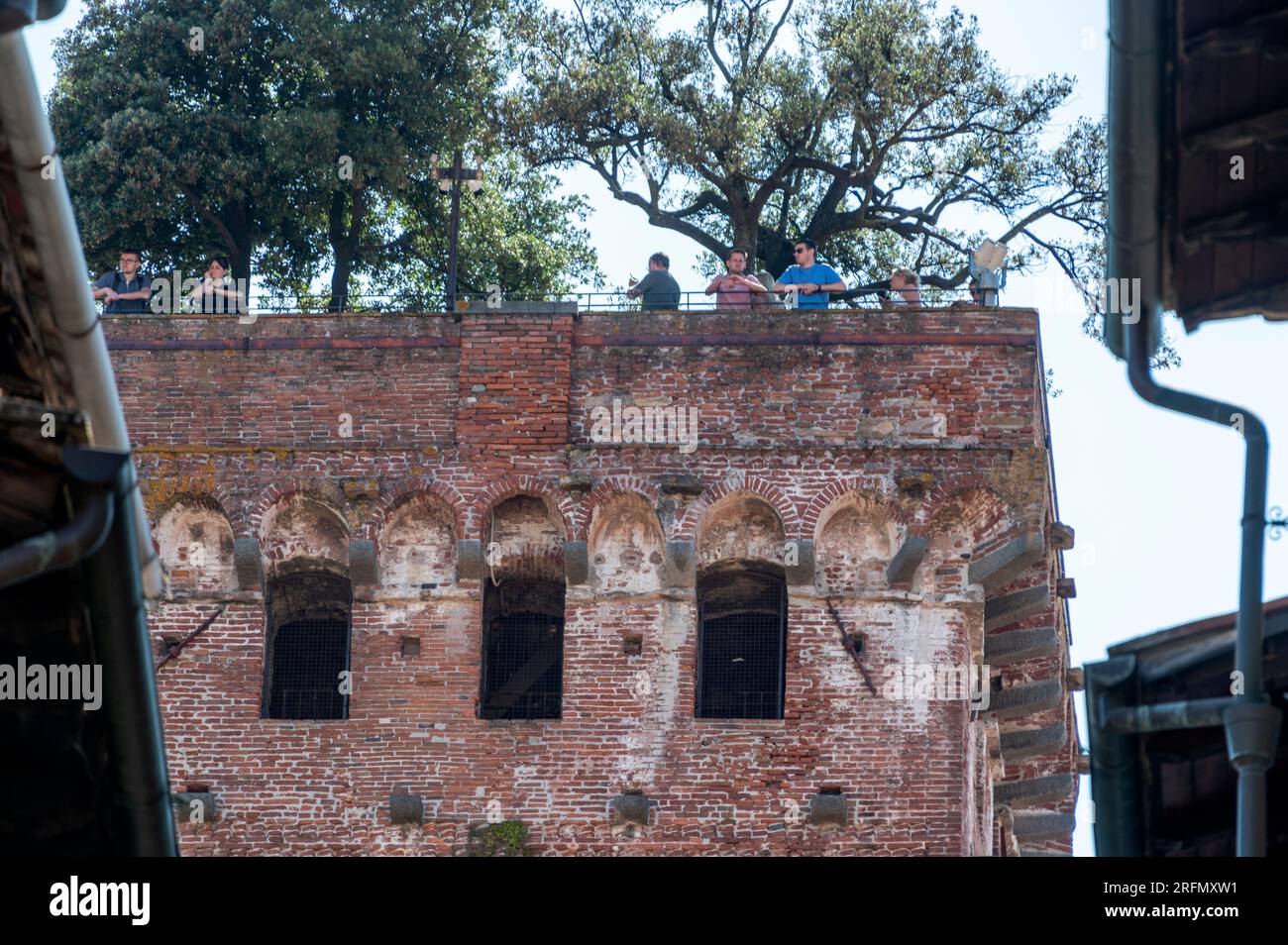 Visitors on the roof garden of Holm oak trees in the 13th century built ...