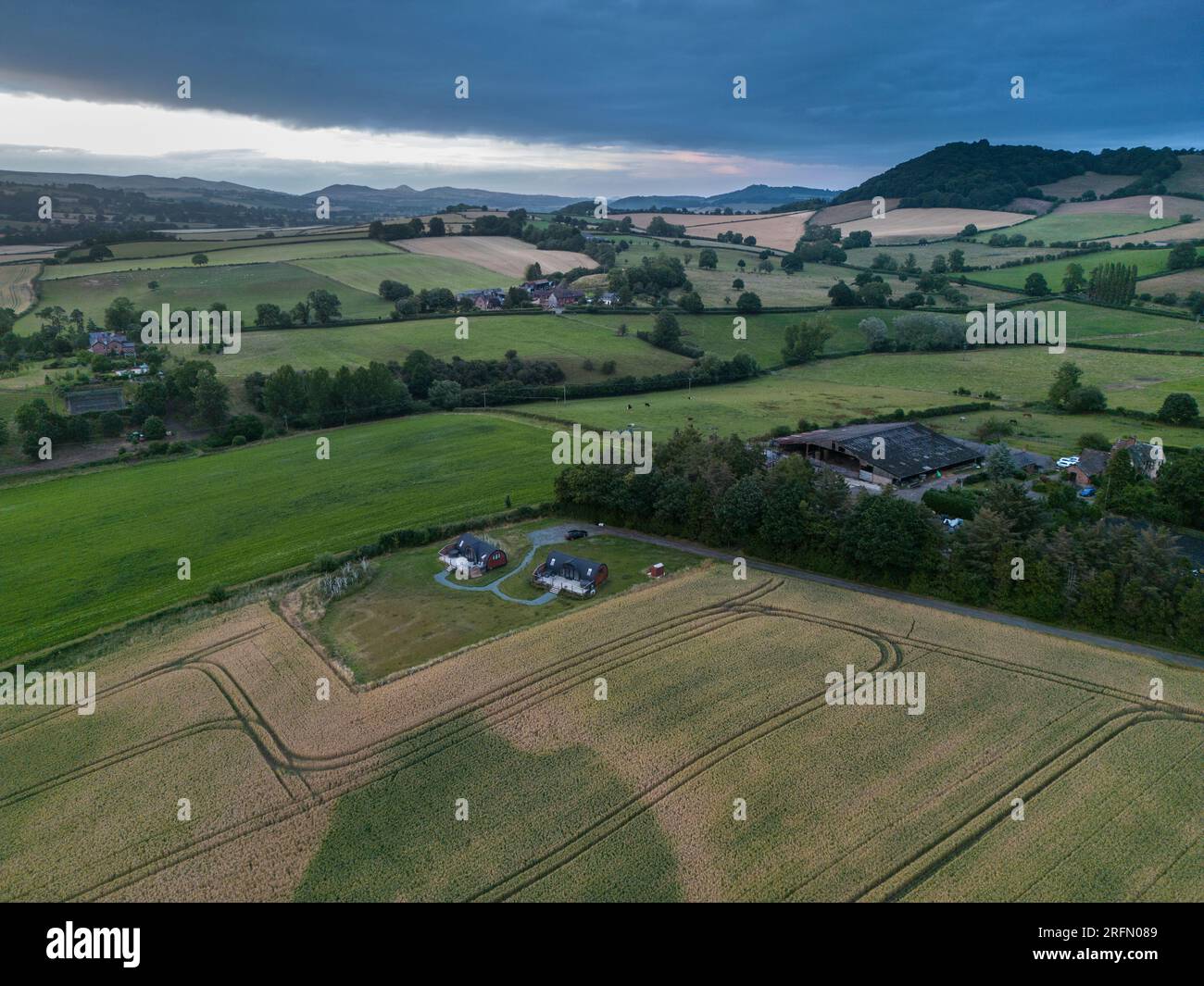 Aerial views of farmland and farm machinery in the Clun Valley ...