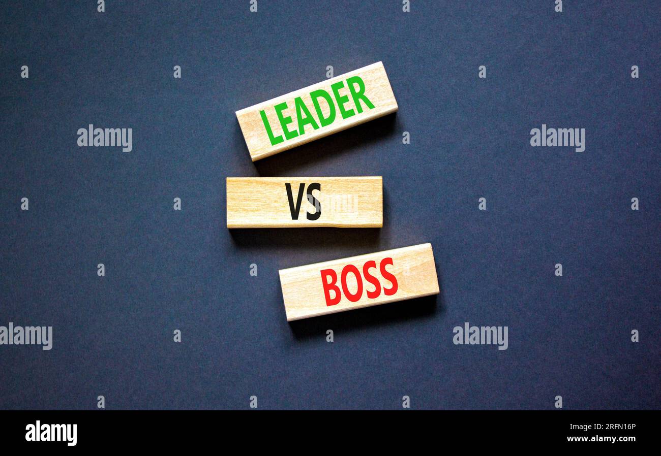 Boss vs leader symbol. Concept words Boss vs versus leader on wooden ...