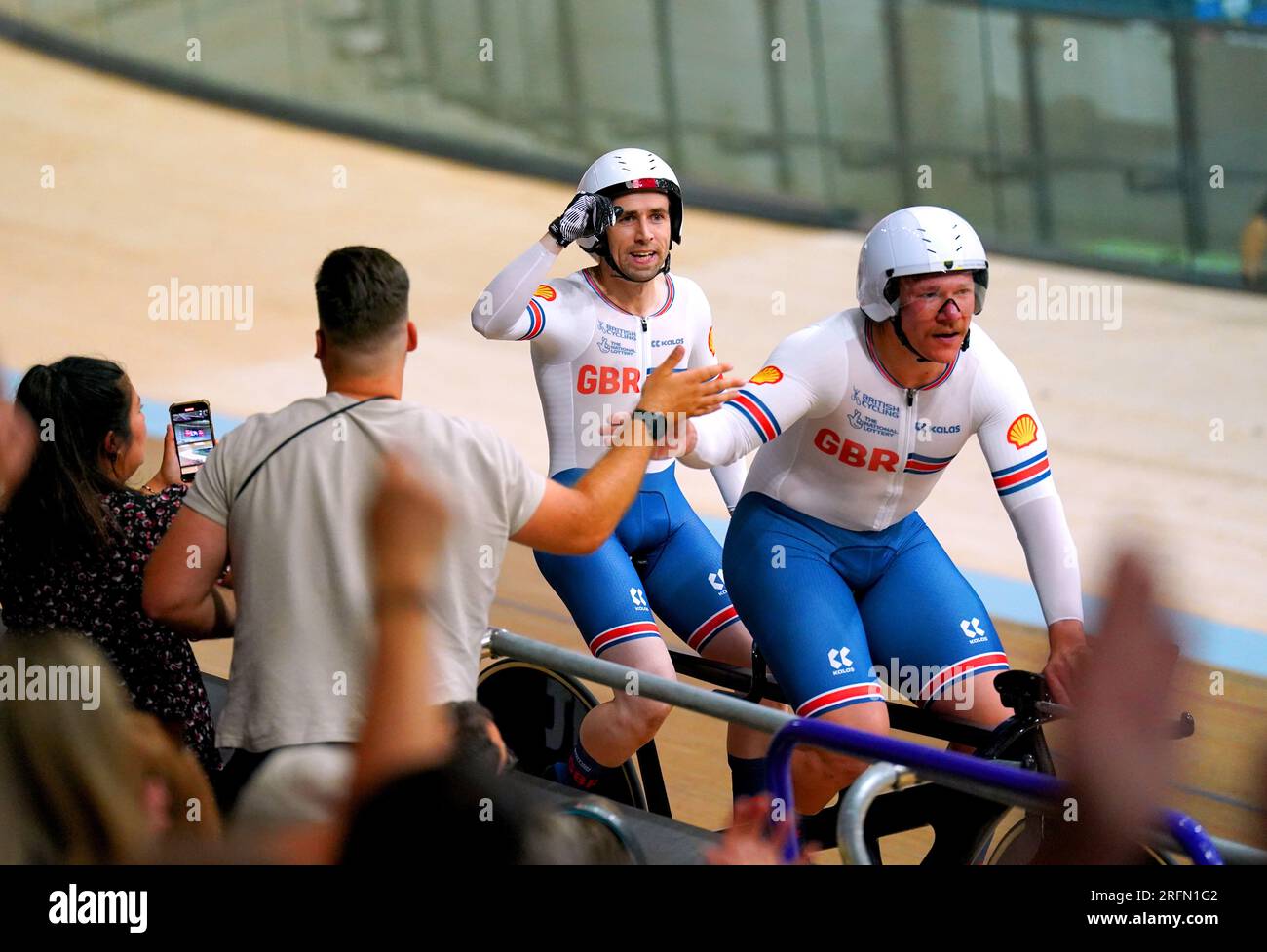 Great Britain's Neil Fachie and pilot Matt Rotherham celebrate winning ...