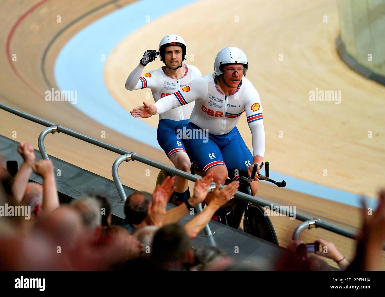 Great Britain's Neil Fachie and pilot Matt Rotherham celebrate winning ...