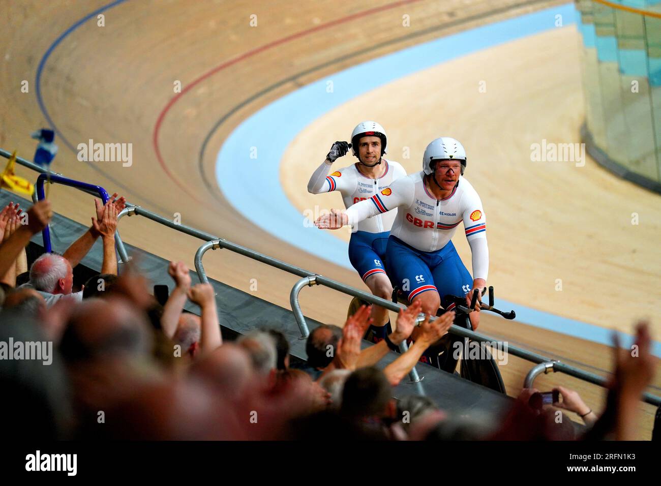 Great Britain's Neil Fachie and pilot Matt Rotherham celebrate winning ...