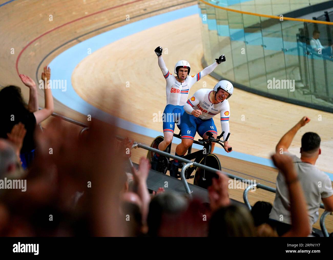Great Britain's Neil Fachie and pilot Matt Rotherham celebrate winning ...
