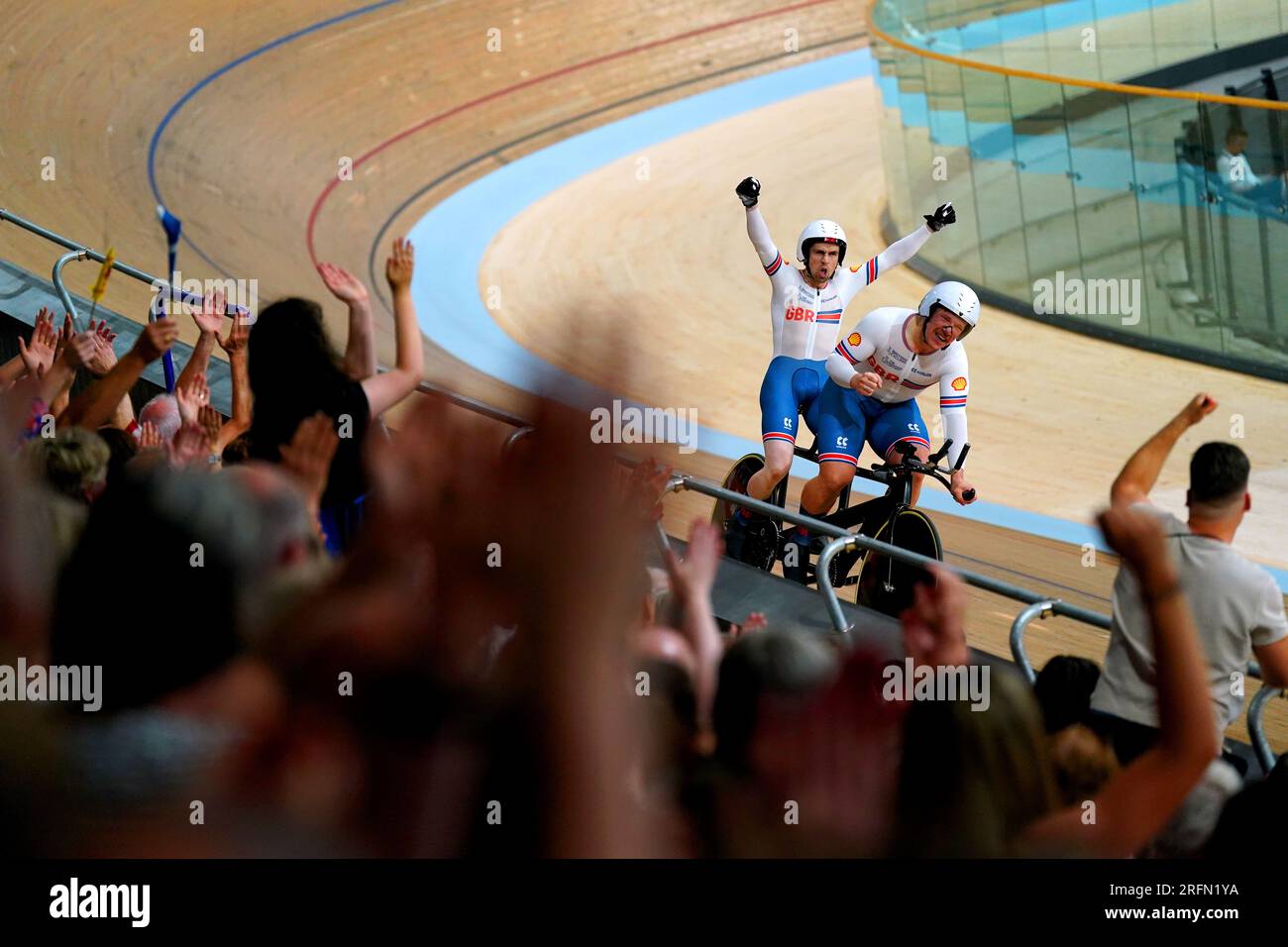 Great Britain's Neil Fachie and pilot Matt Rotherham celebrate winning ...