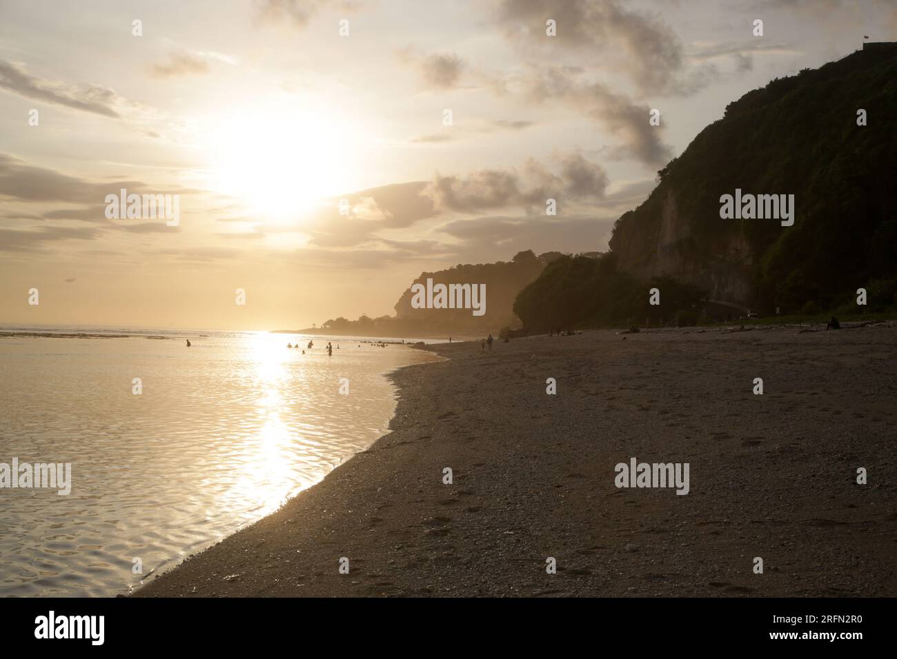 Remote sandy beach during beautiful sunset Stock Photo - Alamy