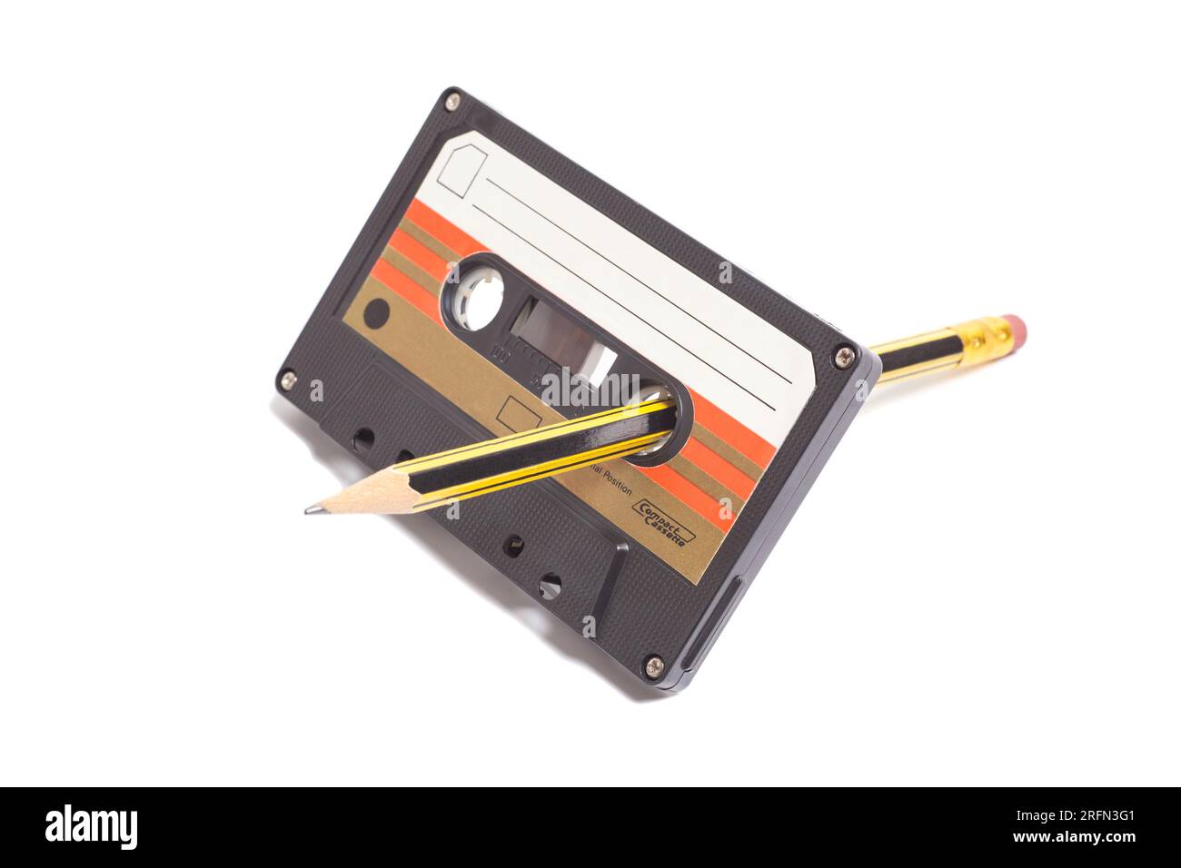 Audio cassette tape with pencil isolated on white background, vintage ...