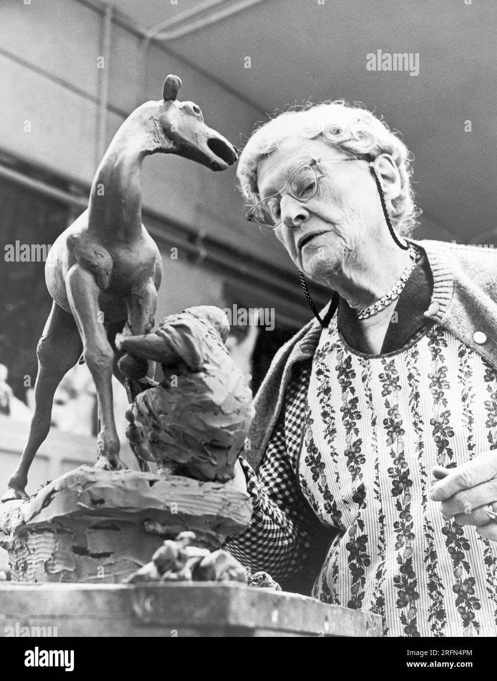 Anna Hyatt Huntington (1876-1973), American sculptor, working on a ...
