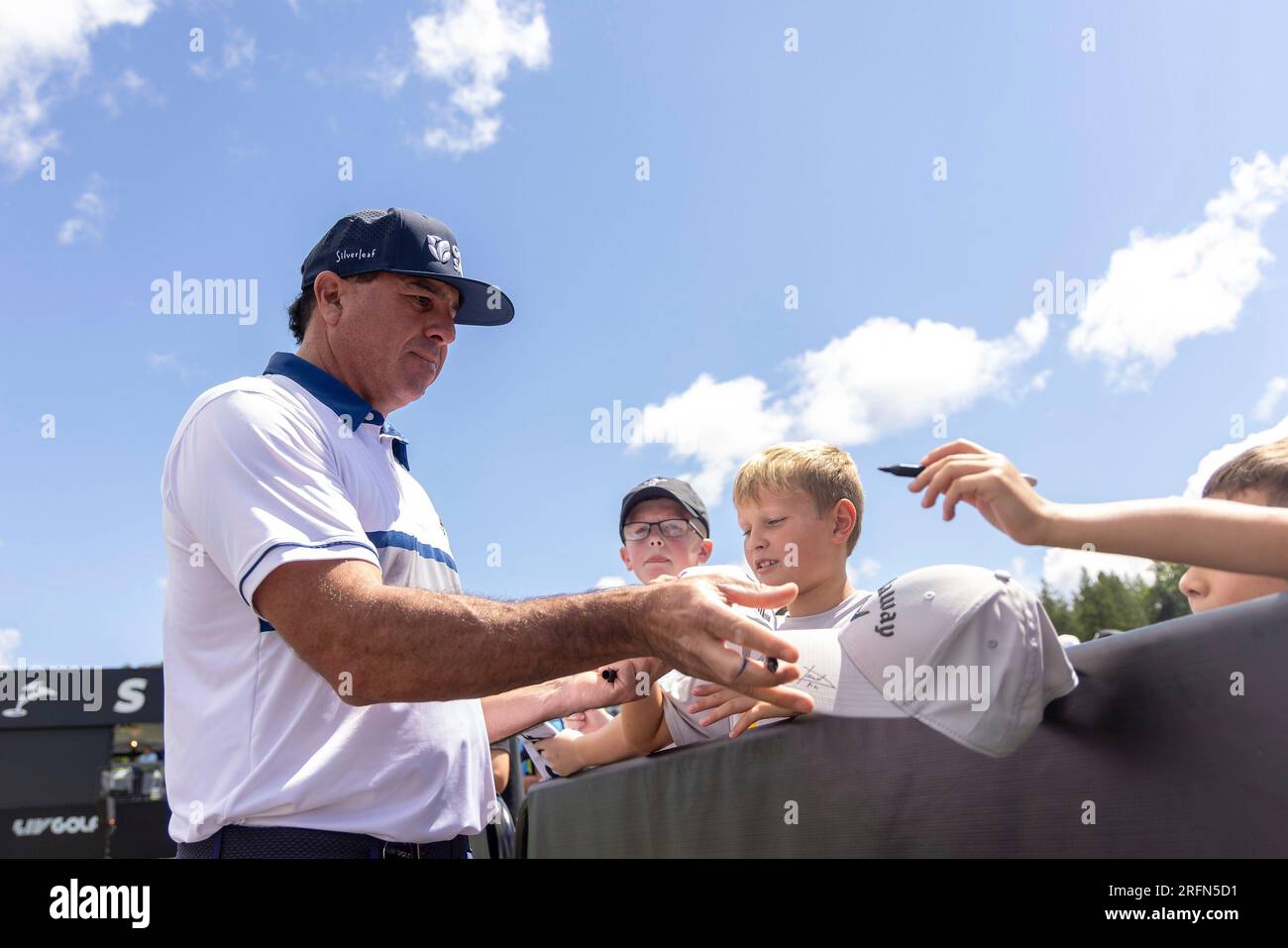 Pat Perez of 4Aces GC signs his autograph for young fans on the driving ...