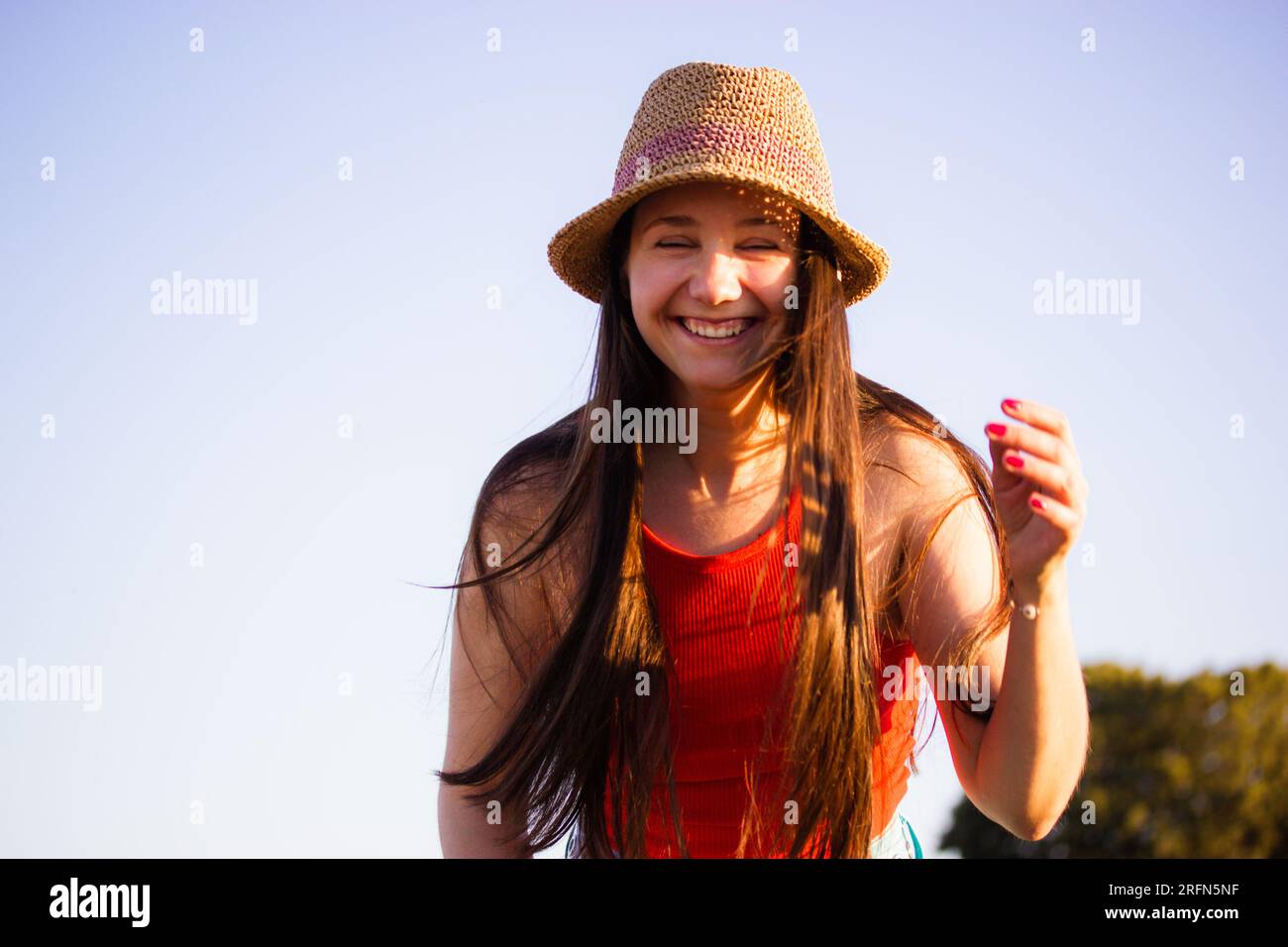 Cheerful young woman laughing loudly merrily outdoors Female portrait ...