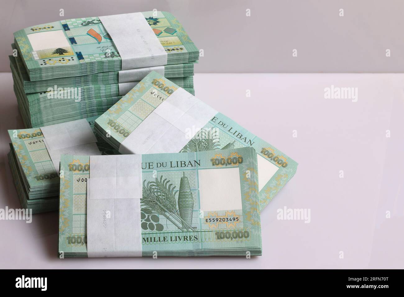 Stacks of Lebanese pounds, 100,000 denomination, symbolizing the ...