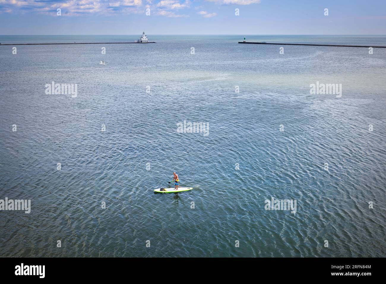 Paddle boarder and pier hi-res stock photography and images - Alamy