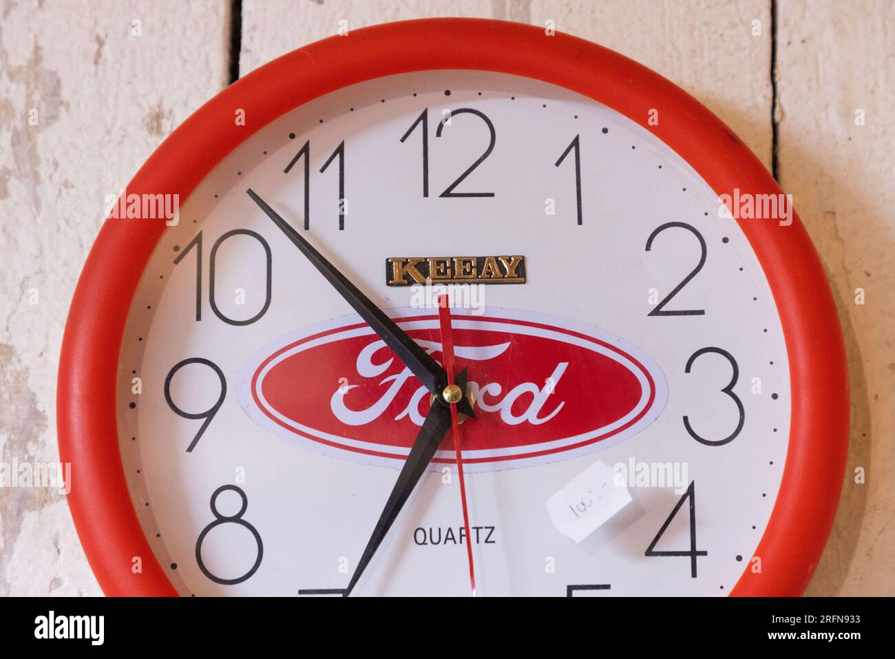 Signs and symbols, a flea market, a wall clock with a Ford emblem on it ...