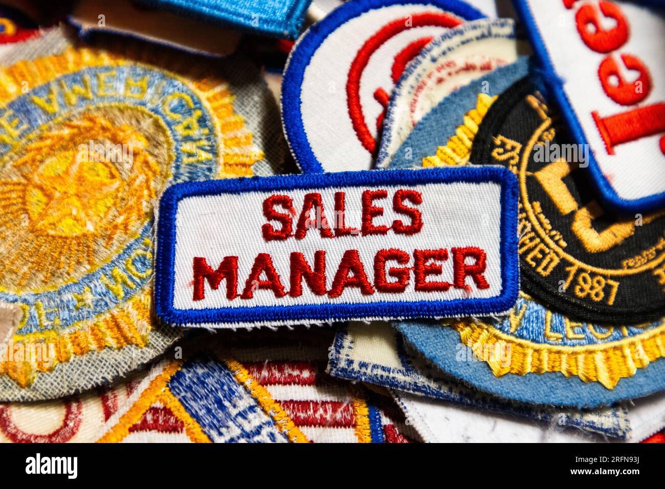 Signs and symbols, a flea market, a Sales manager sign Stock Photo - Alamy