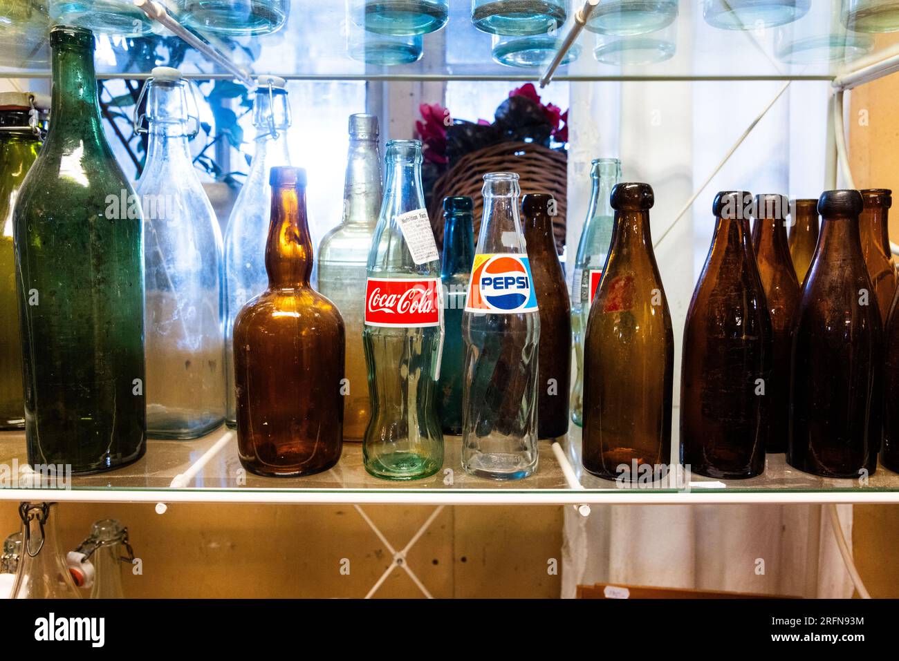 Signs and symbols, a flea market, glass bottles, here a Coca Cola ...