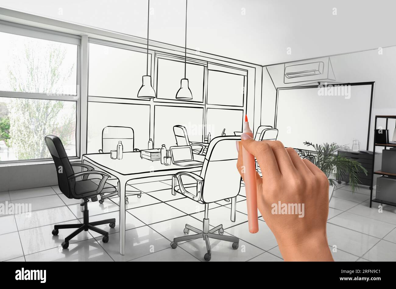 Designer drawing new interior of modern office Stock Photo - Alamy