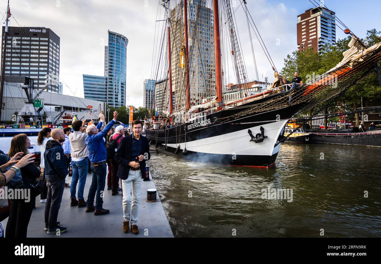 ROTTERDAM - The crew of the Oosterschelde is waved goodbye from the ...