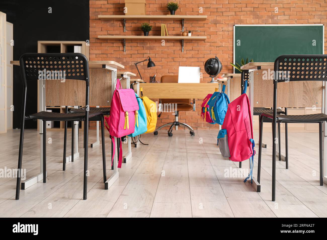 Interior of stylish empty classroom with backpacks and stationery Stock ...