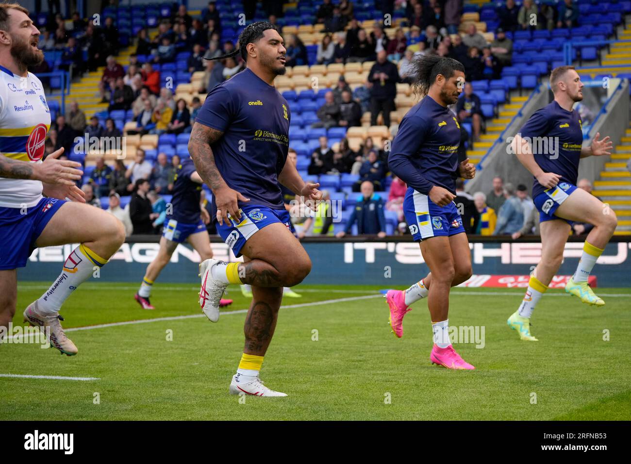 Tom Mikaele #18 of Warrington Wolves warms up before his second debut ...
