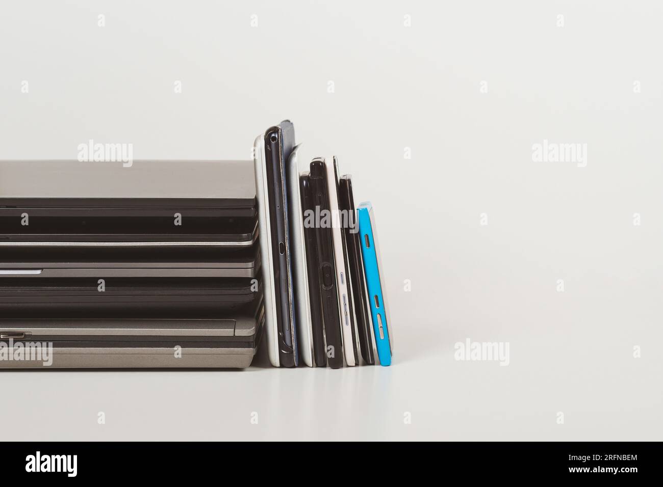 Pile of old used laptop computers, digital tablets, smartphones for ...