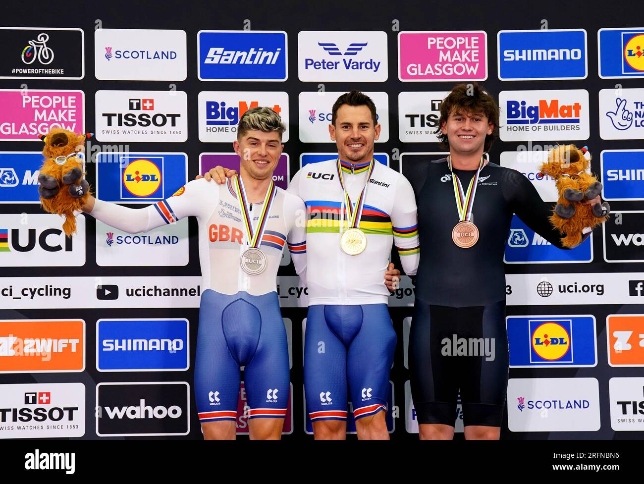 Great Britain's Jaco van Gass (centre) celebrates on the podium after ...
