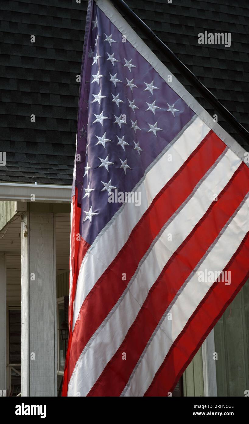 American flag front of house hi-res stock photography and images - Alamy