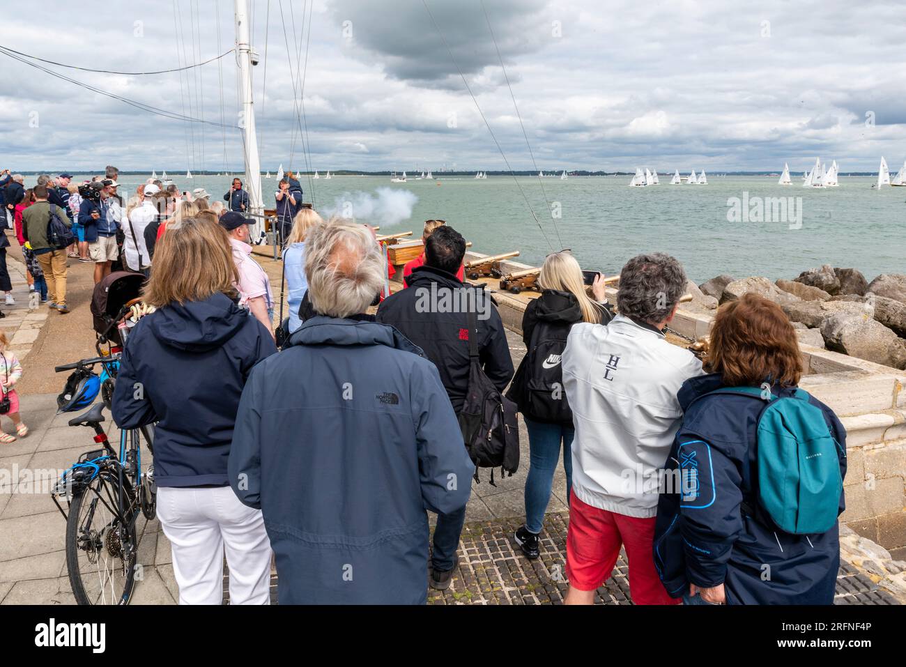 cowes week spectators. tourists and yachtsmen spectating at the royal ...