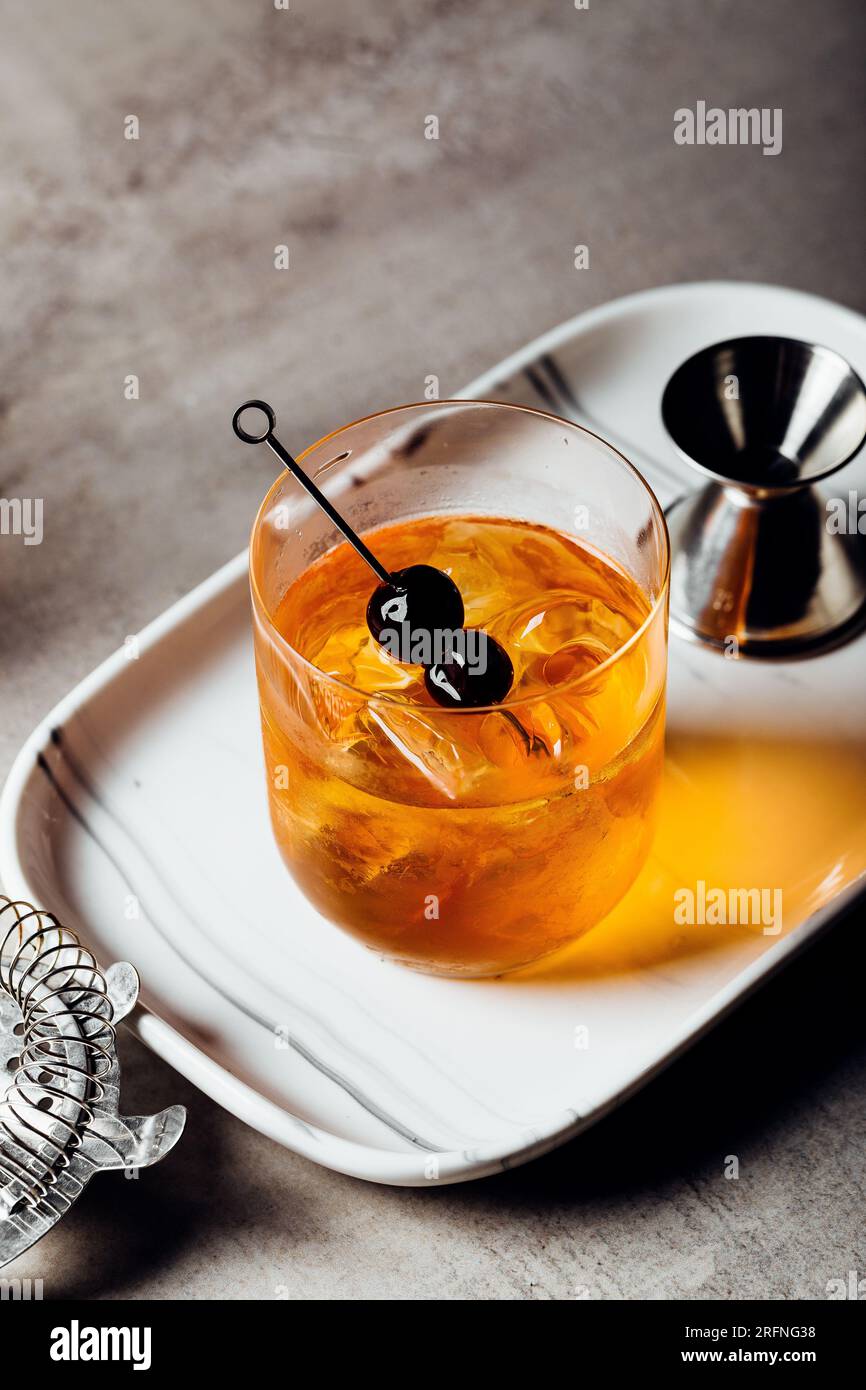 Alcoholic Manhattan Drink on the rocks Bourbon Whiskey and garnish with ...