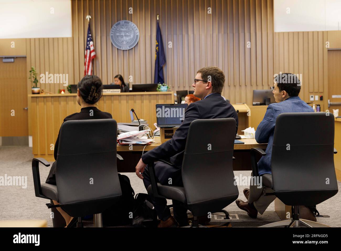 Portland, USA. 04th Aug, 2023. Ngo (R) and his lawyers look at recorded ...