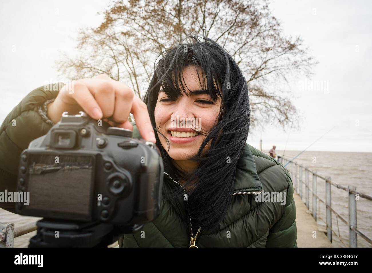 closeup young latin woman vlogger happy smiling pressing the record ...