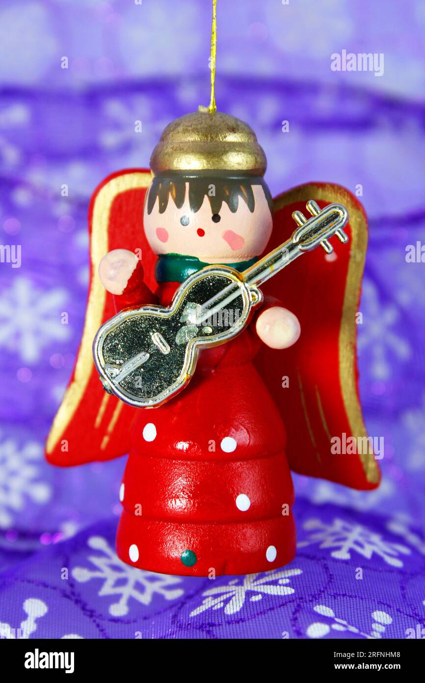 Colorful wooden angel, christmas ornament Stock Photo - Alamy