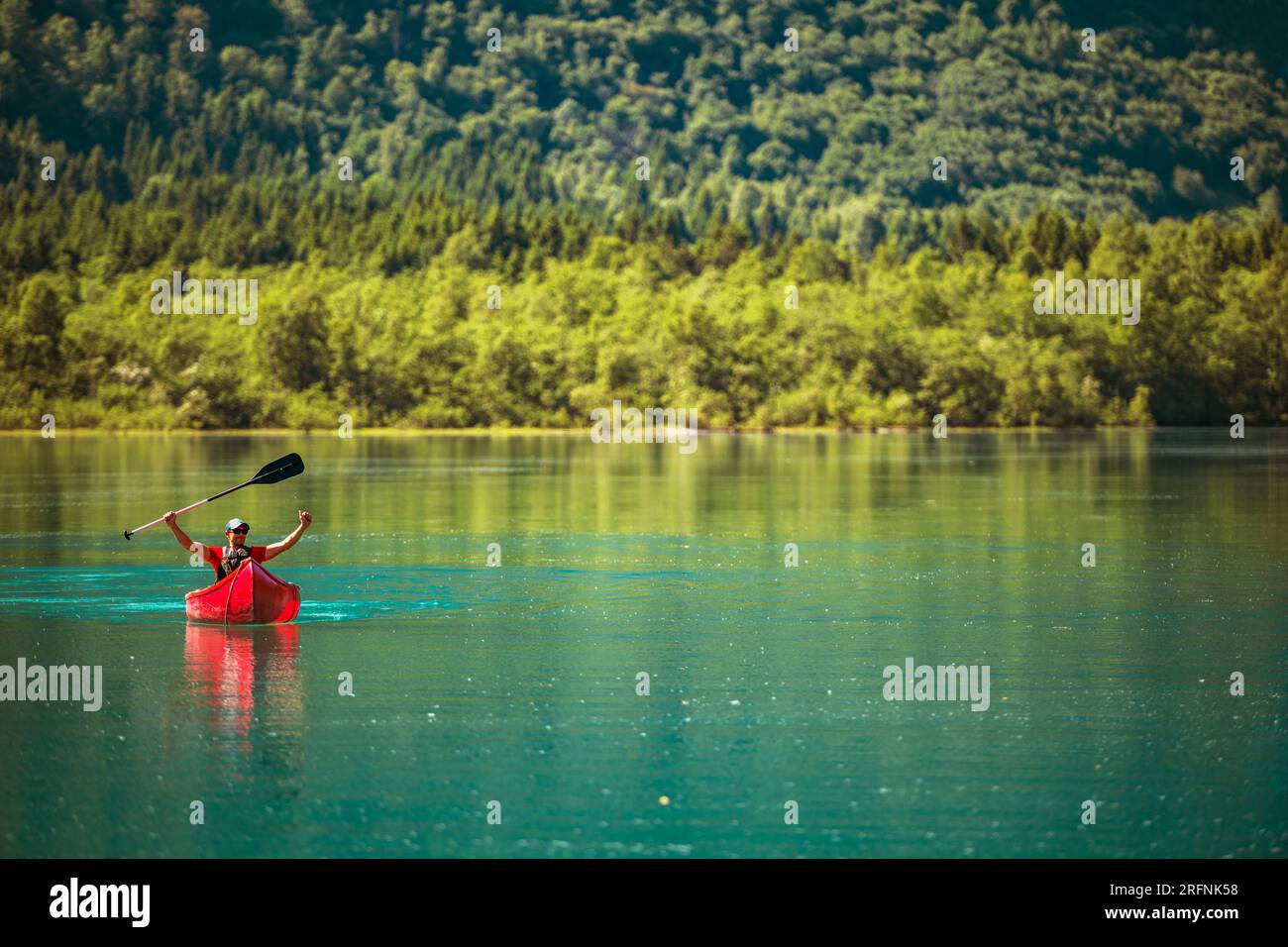 Happy Traveler Inside Red Canoe on a Glacial Lake with His Hands Up ...