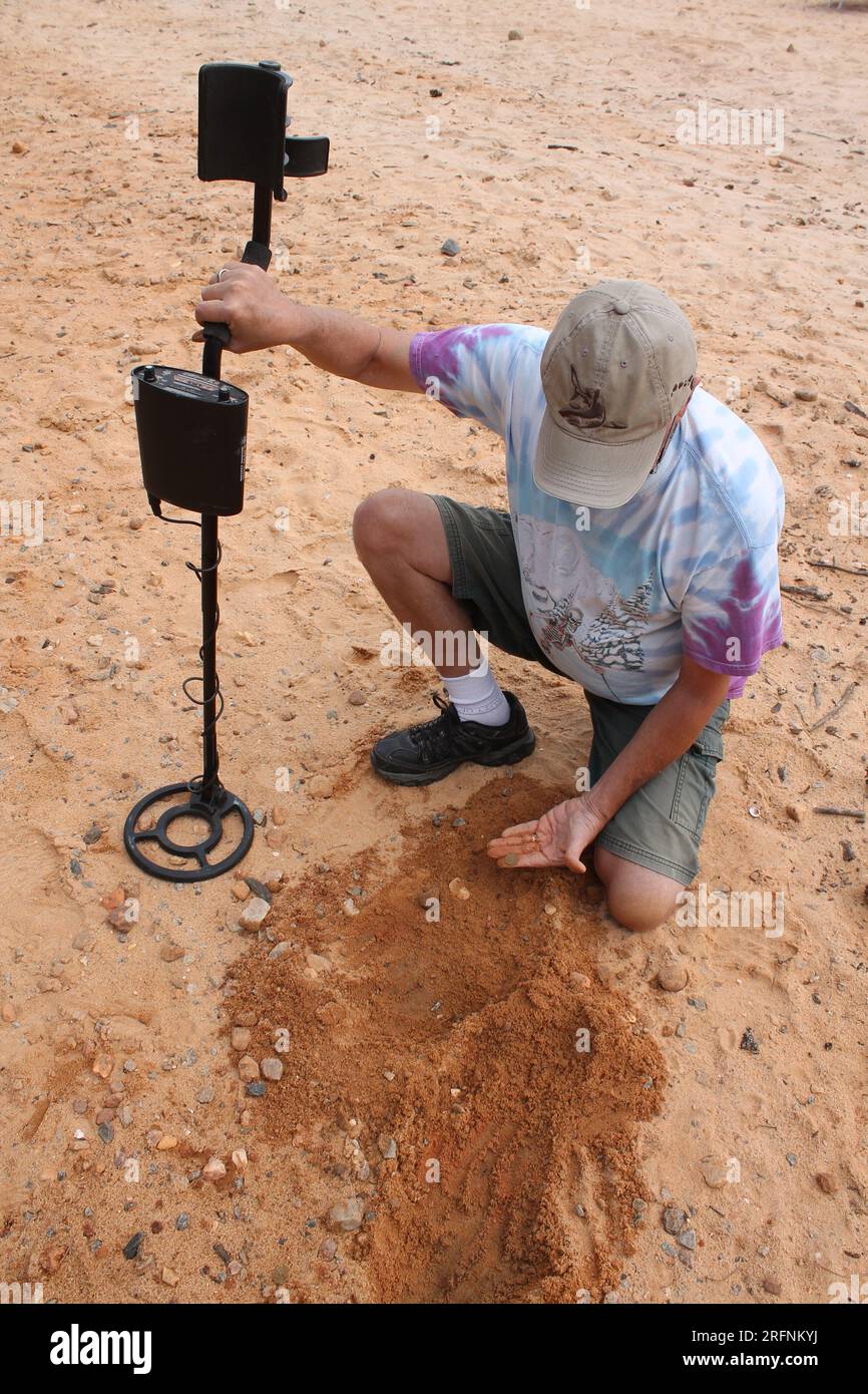 Senior Citizen using a Metal Detector Stock Photo - Alamy