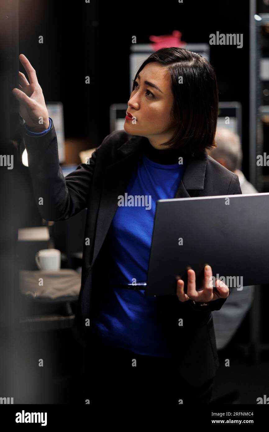 Detective woman in criminology agency cabinet room looking for criminal ...