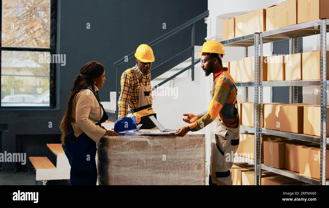 Group of young workers putting products in boxes, working on production ...