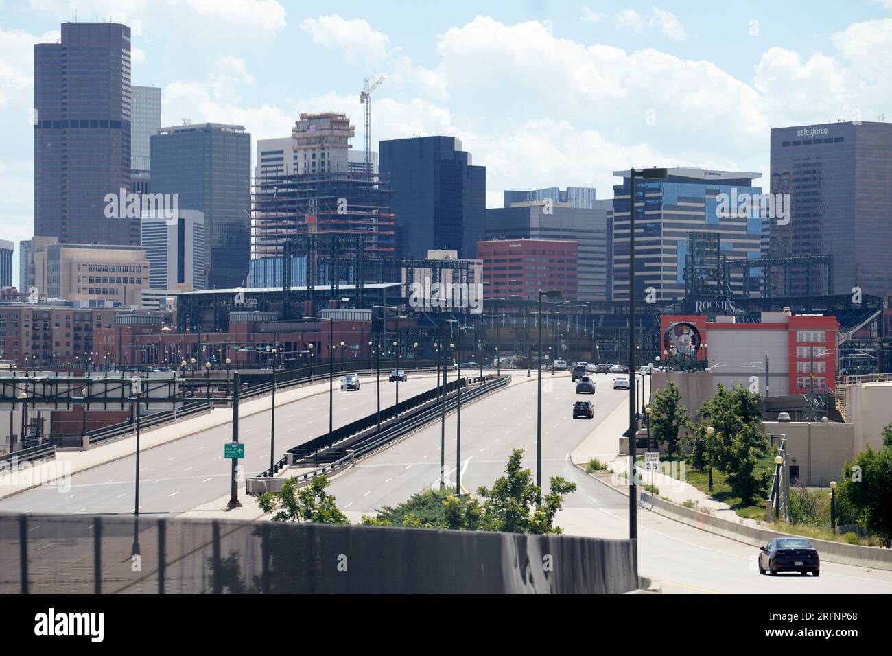 Motorists move along Park Avenue as a haze slightly shrouds the skyline ...