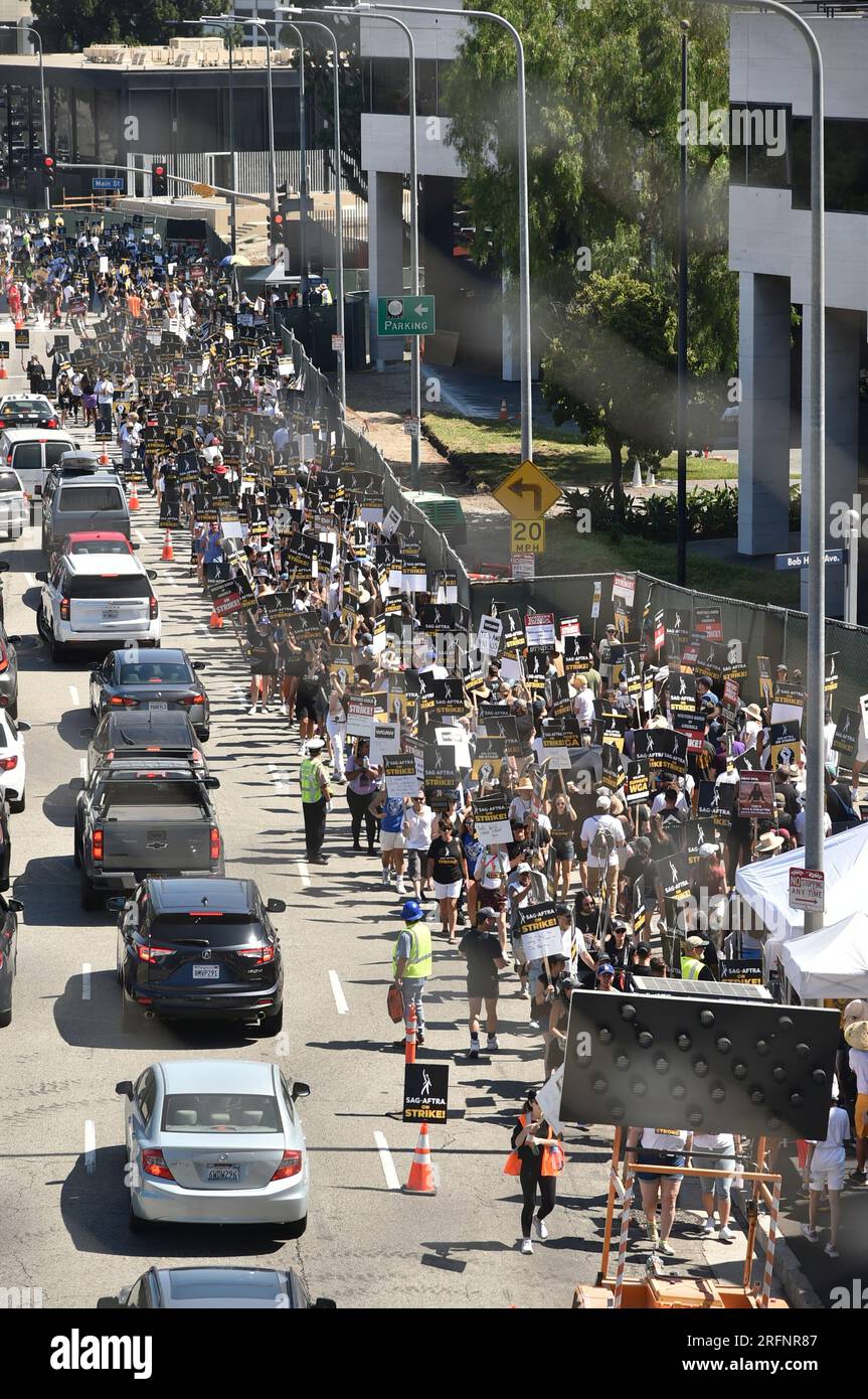 Picketers carry signs on the picket line outside Universal Studios on ...