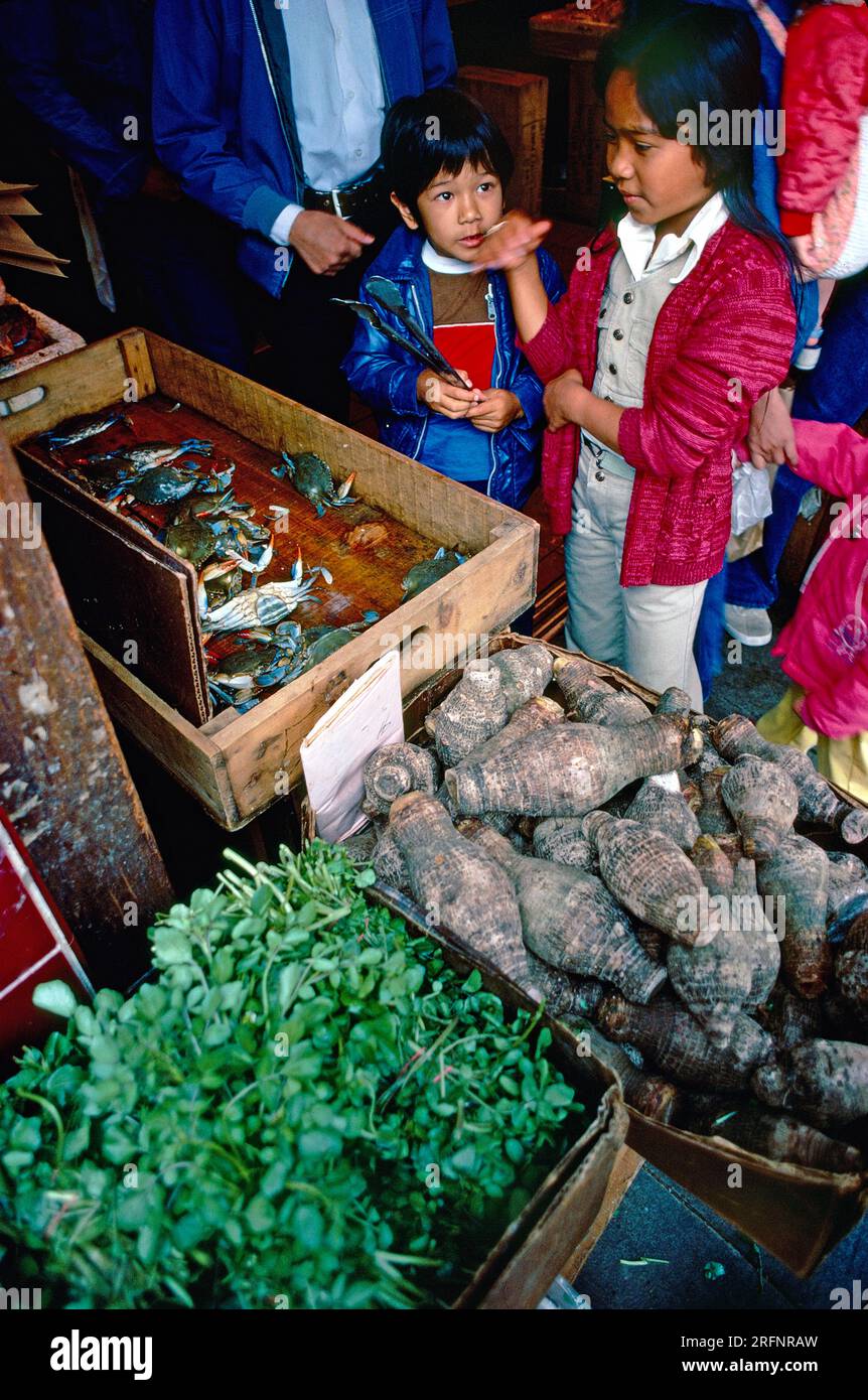 Chinese kids in a street market, Chinatown, San Francisco, California ...