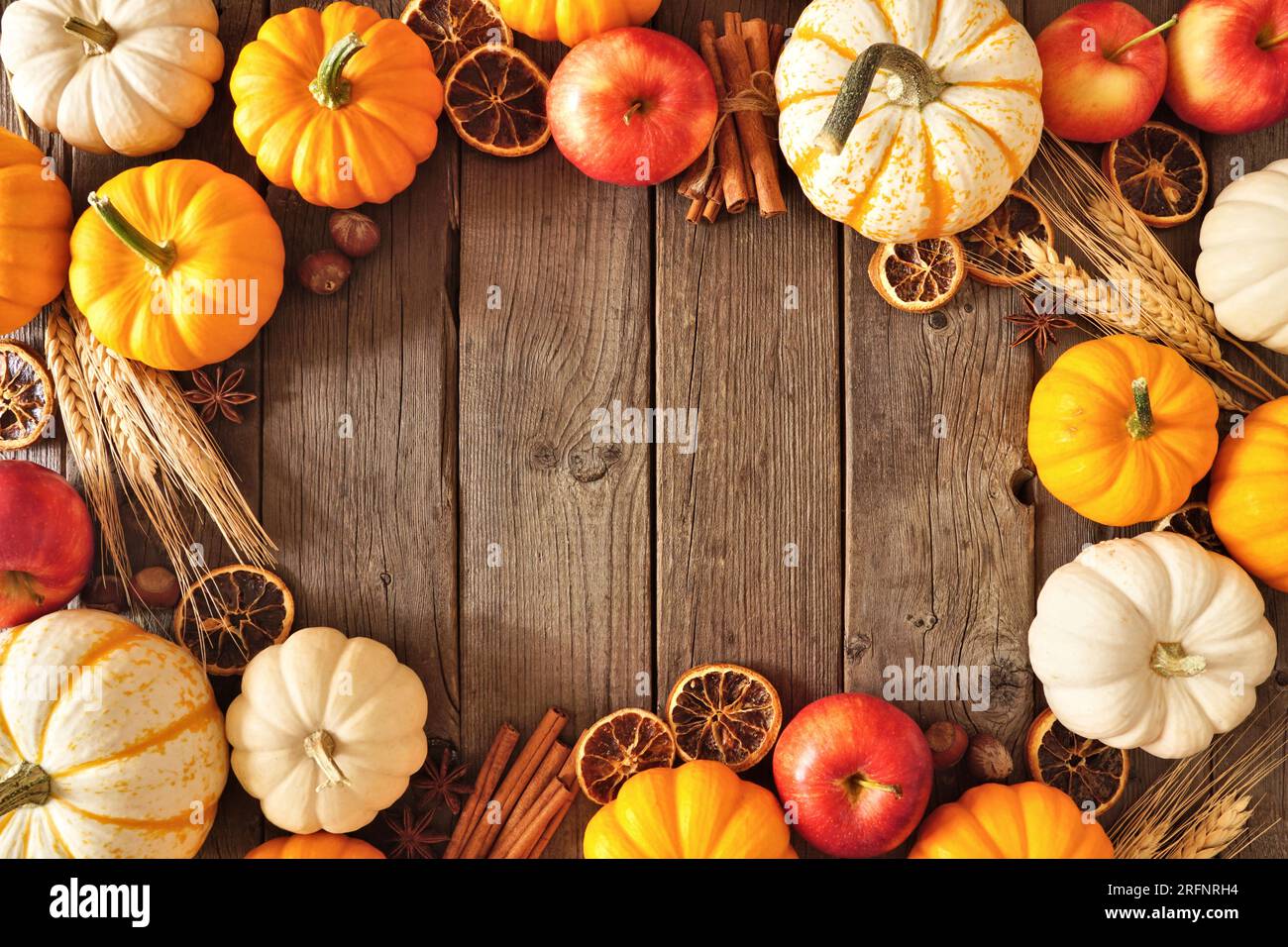 Fall frame of pumpkins, apples and spices. Overhead view on a rustic ...