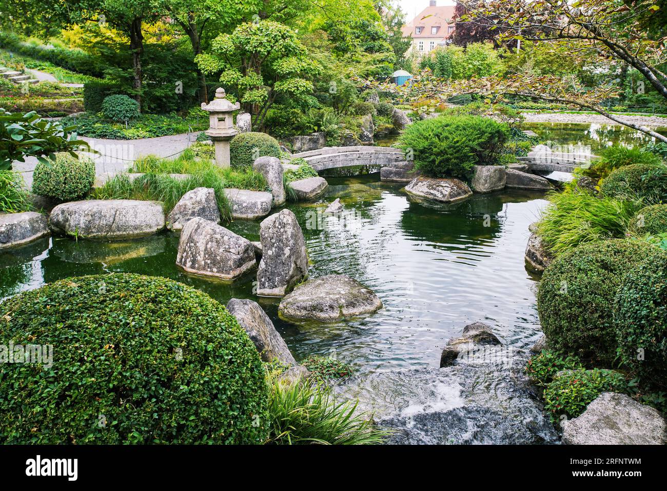 Amazing Japanese garden in Wurzburg with small waterfalls , pond and stone bridge, lantern and ...