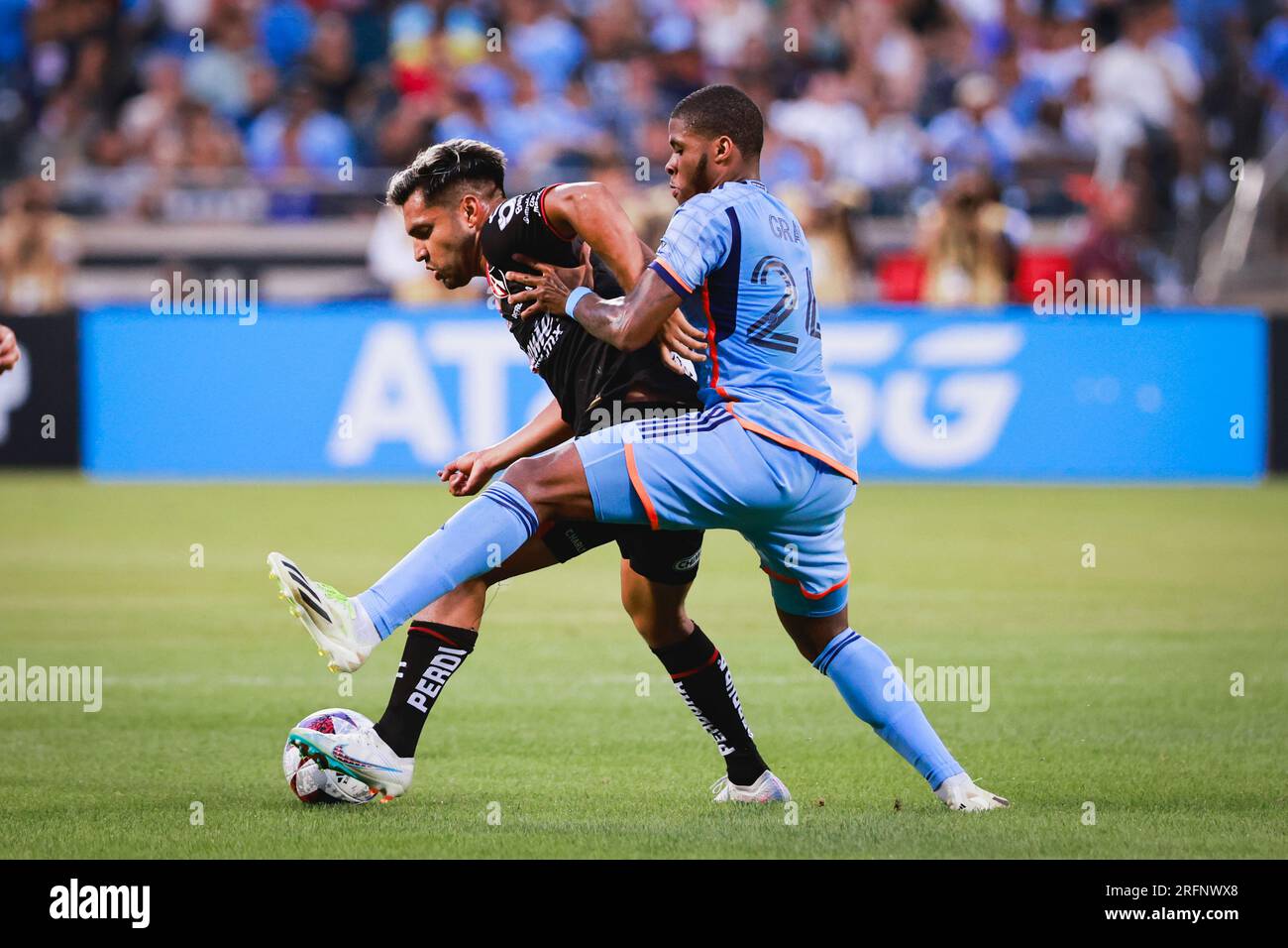 Atlas FC Forward Eduardo Aguirre (30) fights for possession against ...
