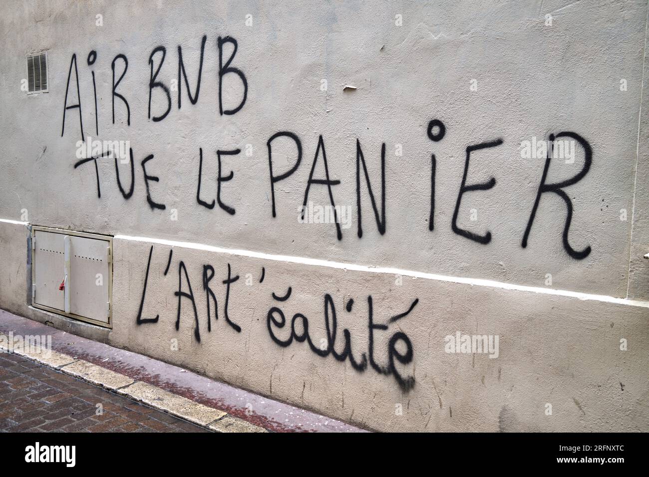 Anti Airbnb protest graffiti in Le Panier District Marseille France ...